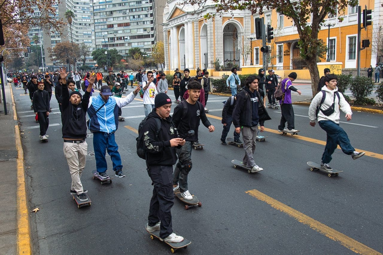 Skaters perform through a ring of fire at Go Skateboarding event