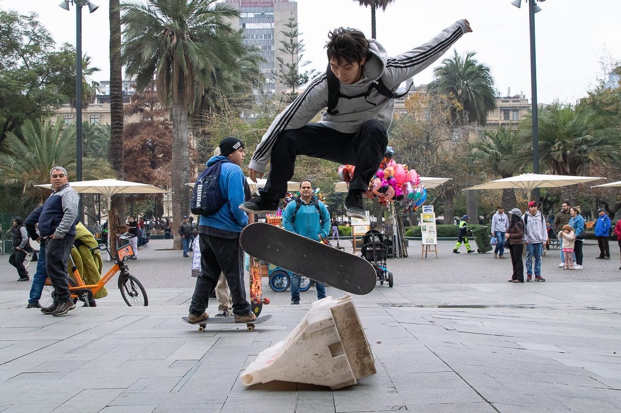 Skaters perform through a ring of fire at Go Skateboarding event